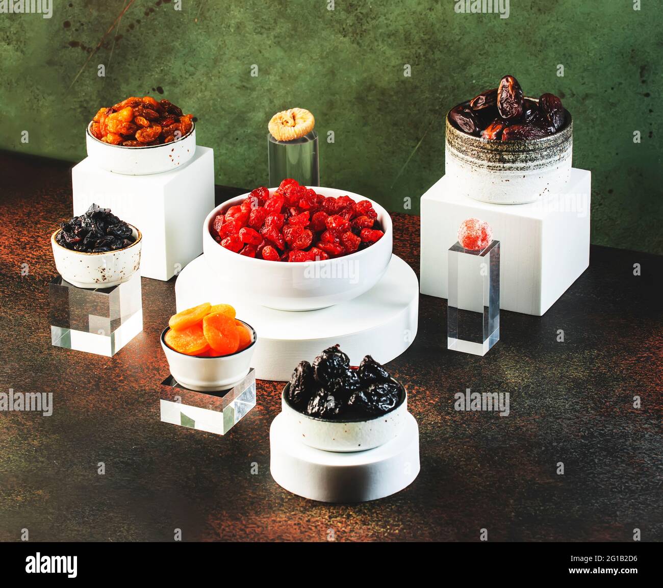 Healthy food snacks: natural dried fruits in bowls on rusty green ...