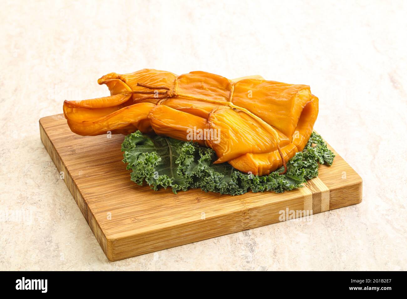 Smoked squid calamar appetizer snack isolated Stock Photo - Alamy