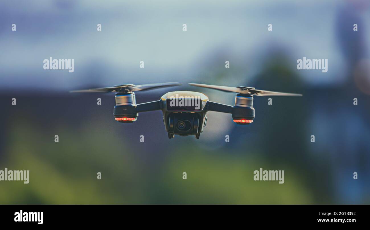 Drone in the air in hovering position with beautiful bokeh effect ...