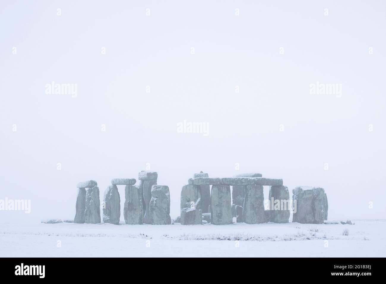 A snowy blizzard encircling the ancient isolated rocks of Stonehenge in ...