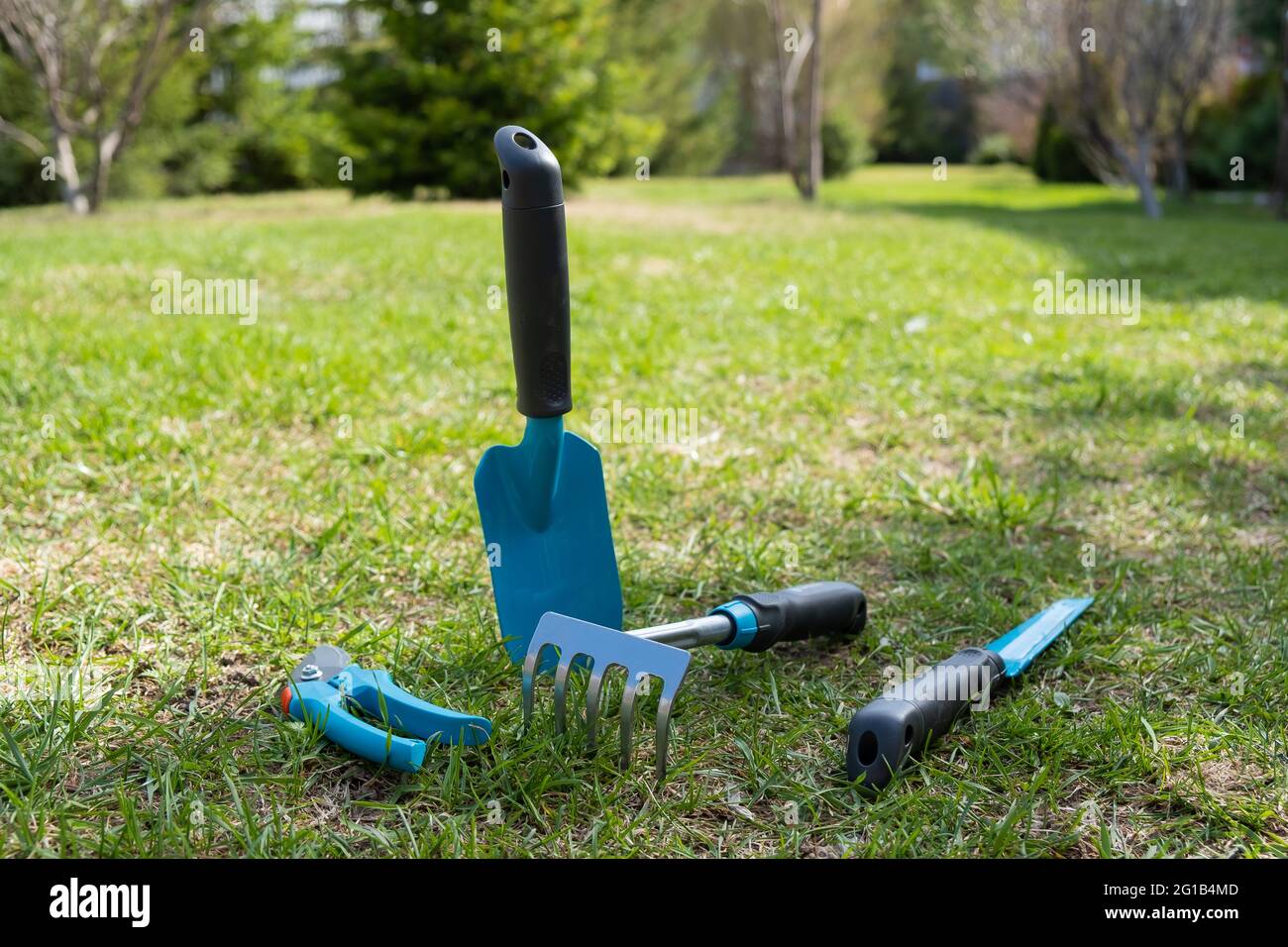 Gardening tools on the lawn Stock Photo - Alamy