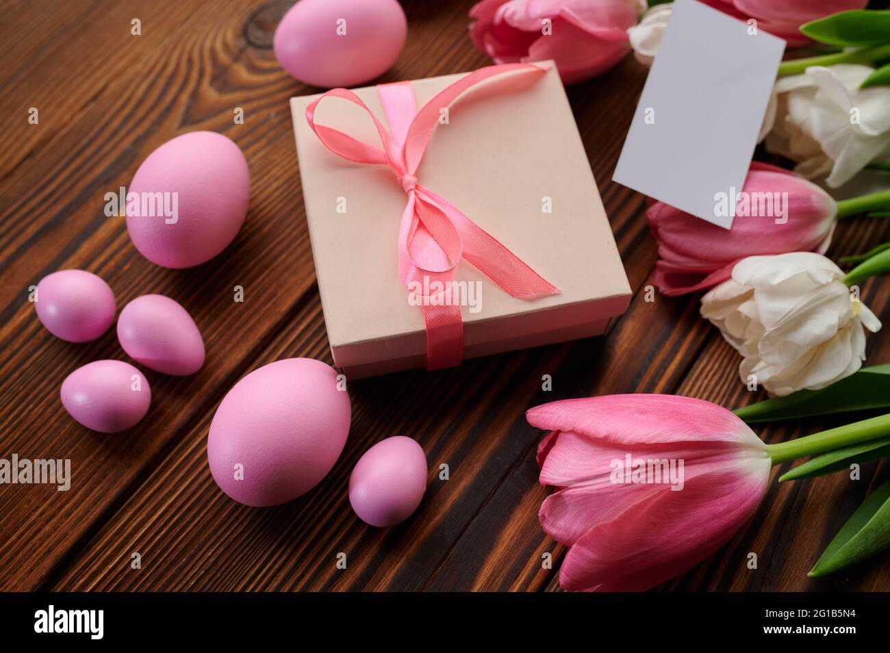 Pink tulips, easter eggs and gift box Stock Photo - Alamy