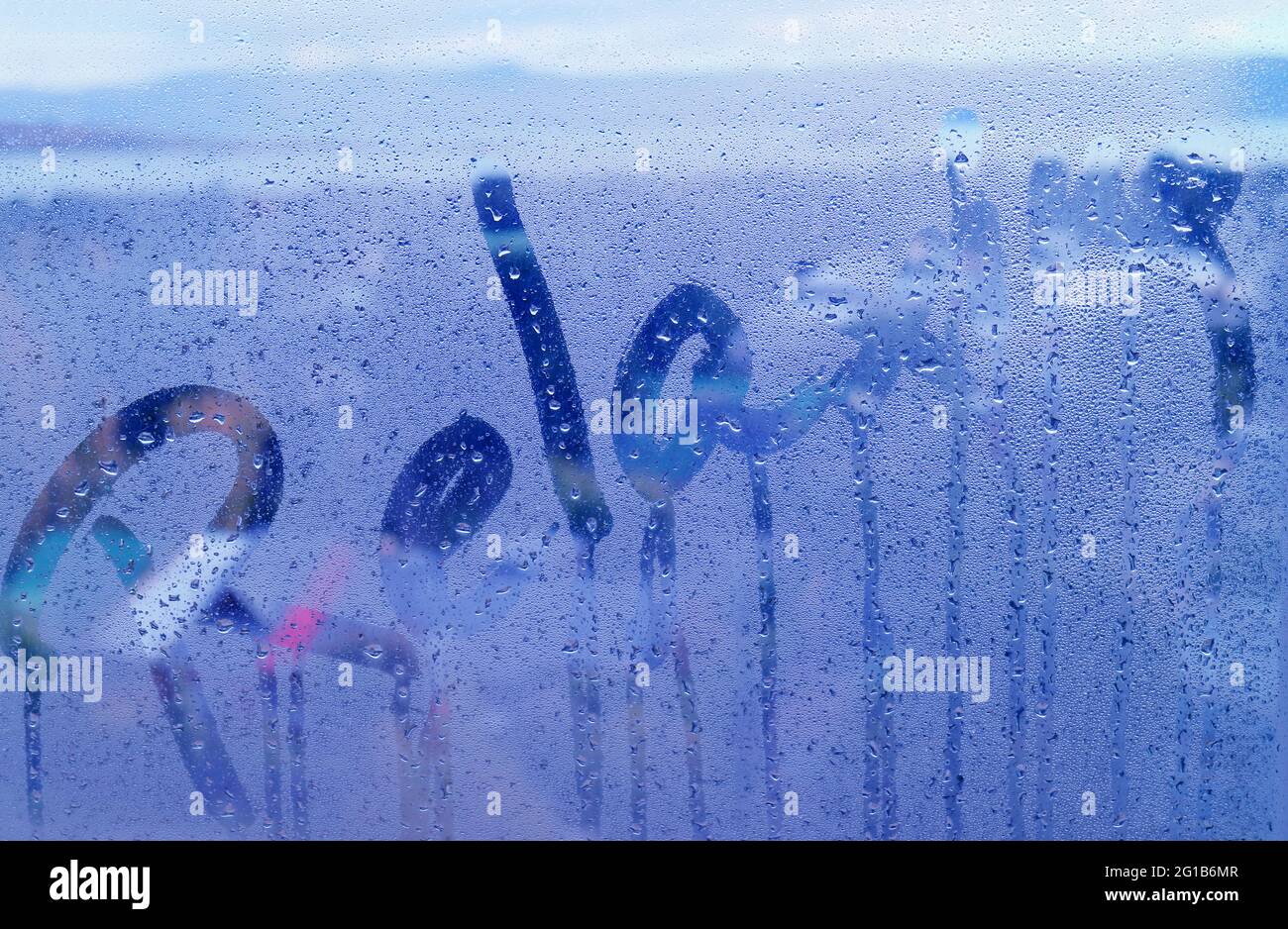 Pop art style blue colored hand writing inscription of "Relaxing" on ...