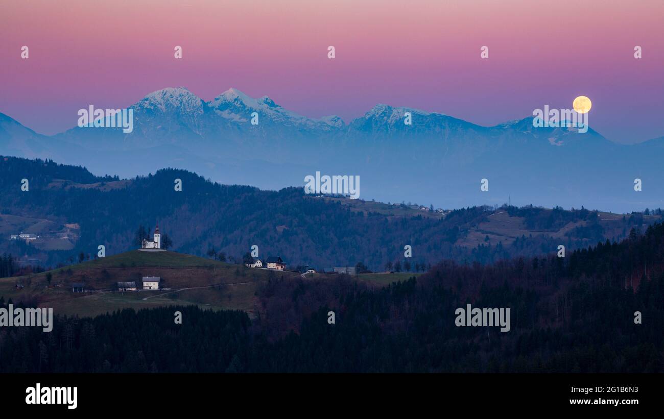 The full moon rising in winter over the mountains behind Sveti Tomaz ...