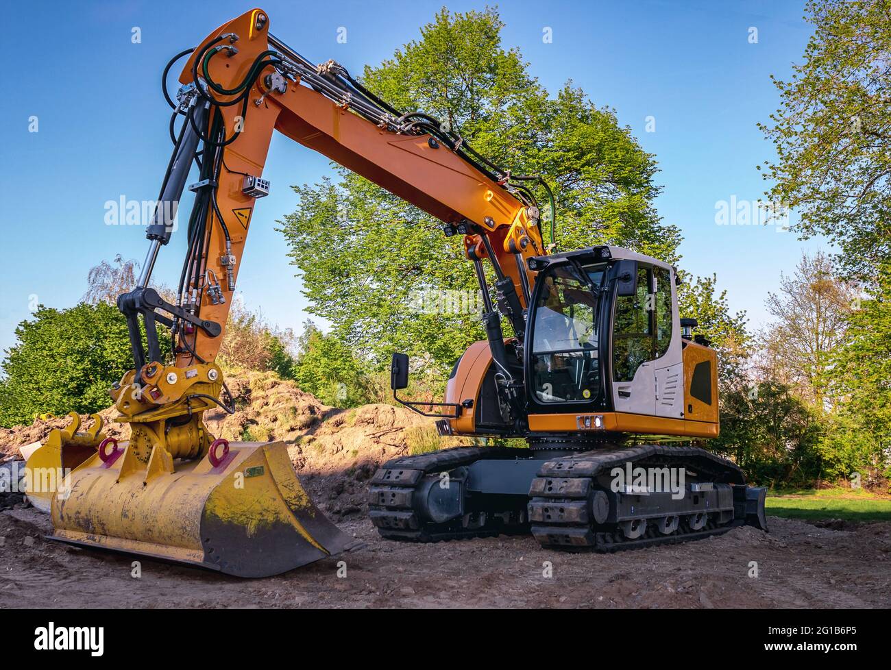 Excavator construction machine for excavating and backfilling of earth ...