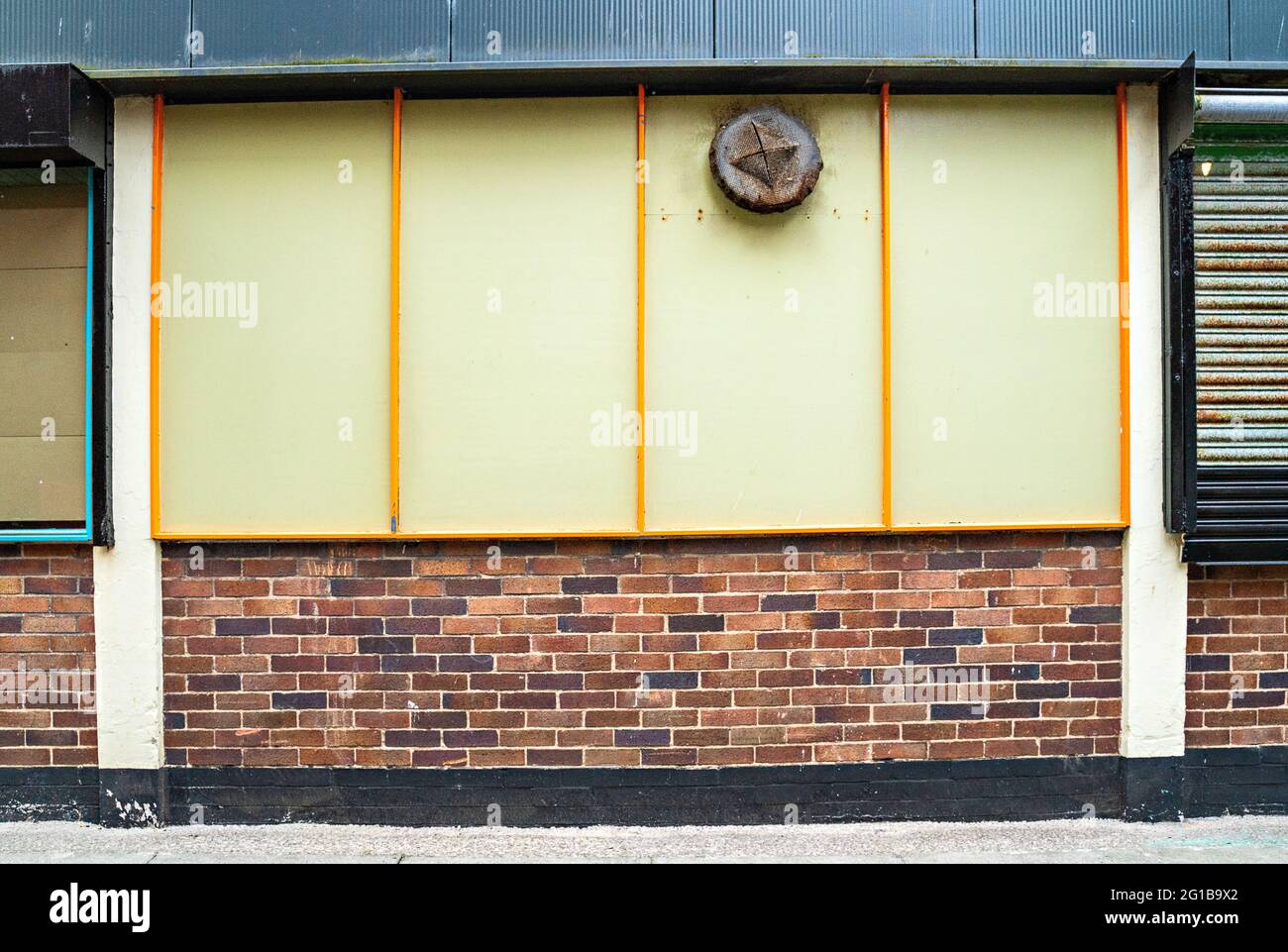 Blocked shop window on side street Stock Photo - Alamy