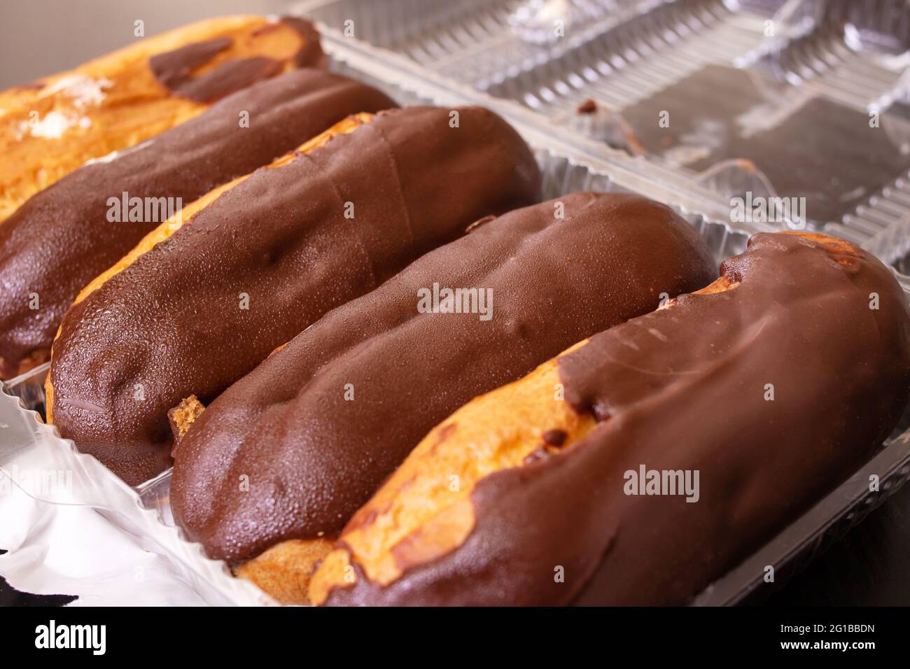 Chocolate custard cakes in plastik box close up Stock Photo - Alamy