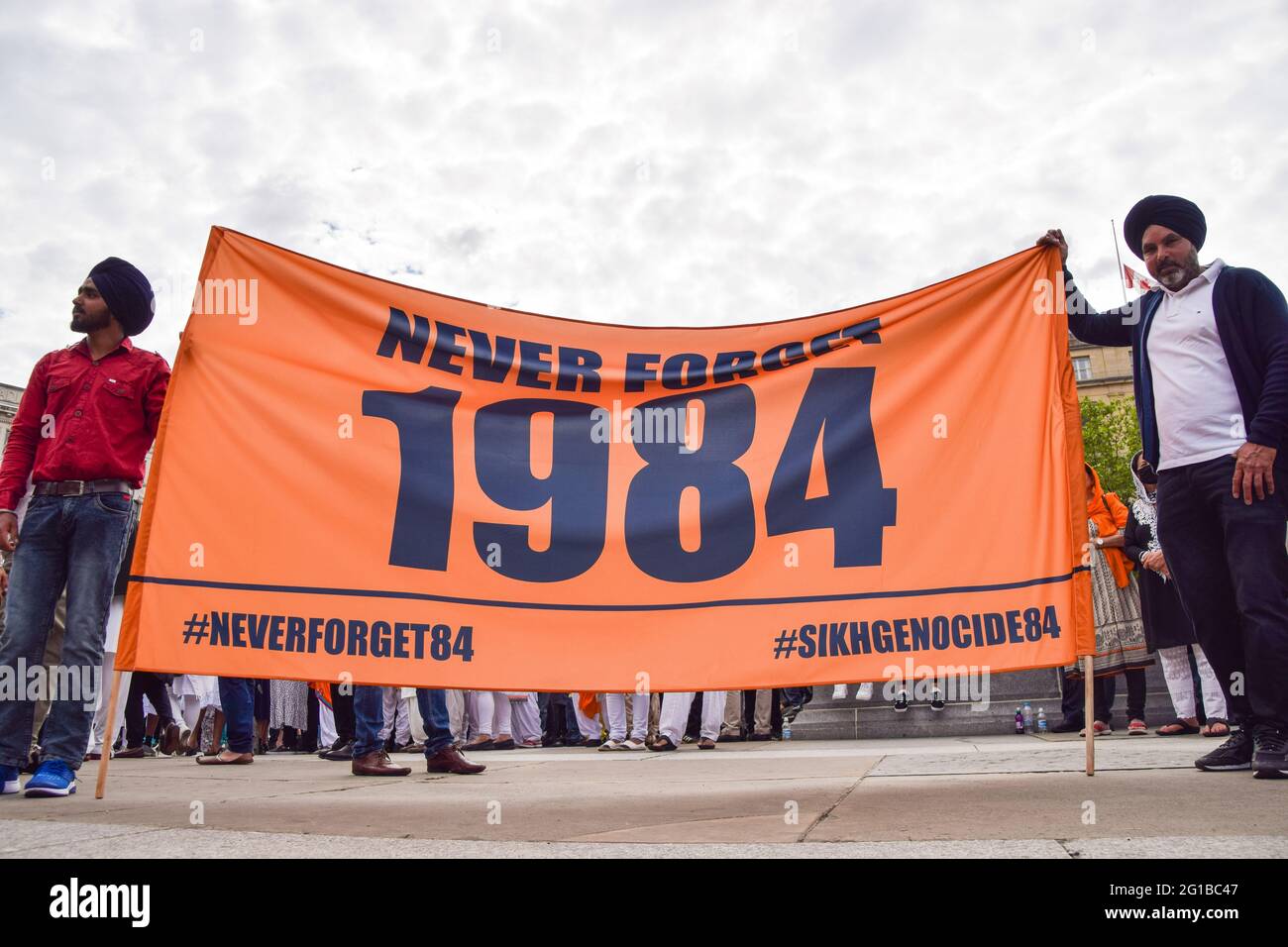 Protesters hold a 1984 banner in Trafalgar Square during the rally ...
