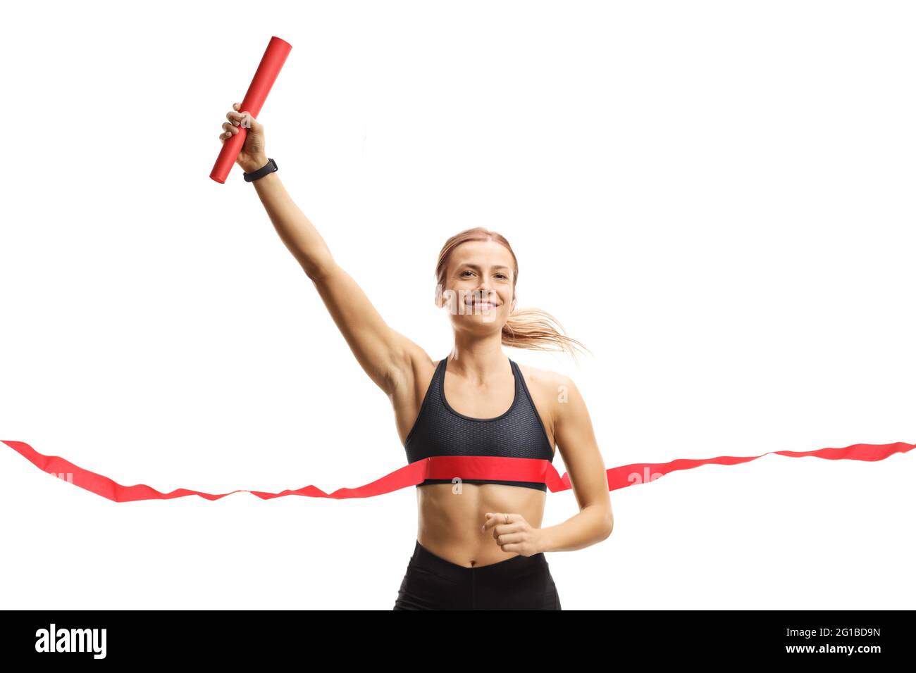 Smiling woman finishing a relay race with a baton in her hand isolated ...
