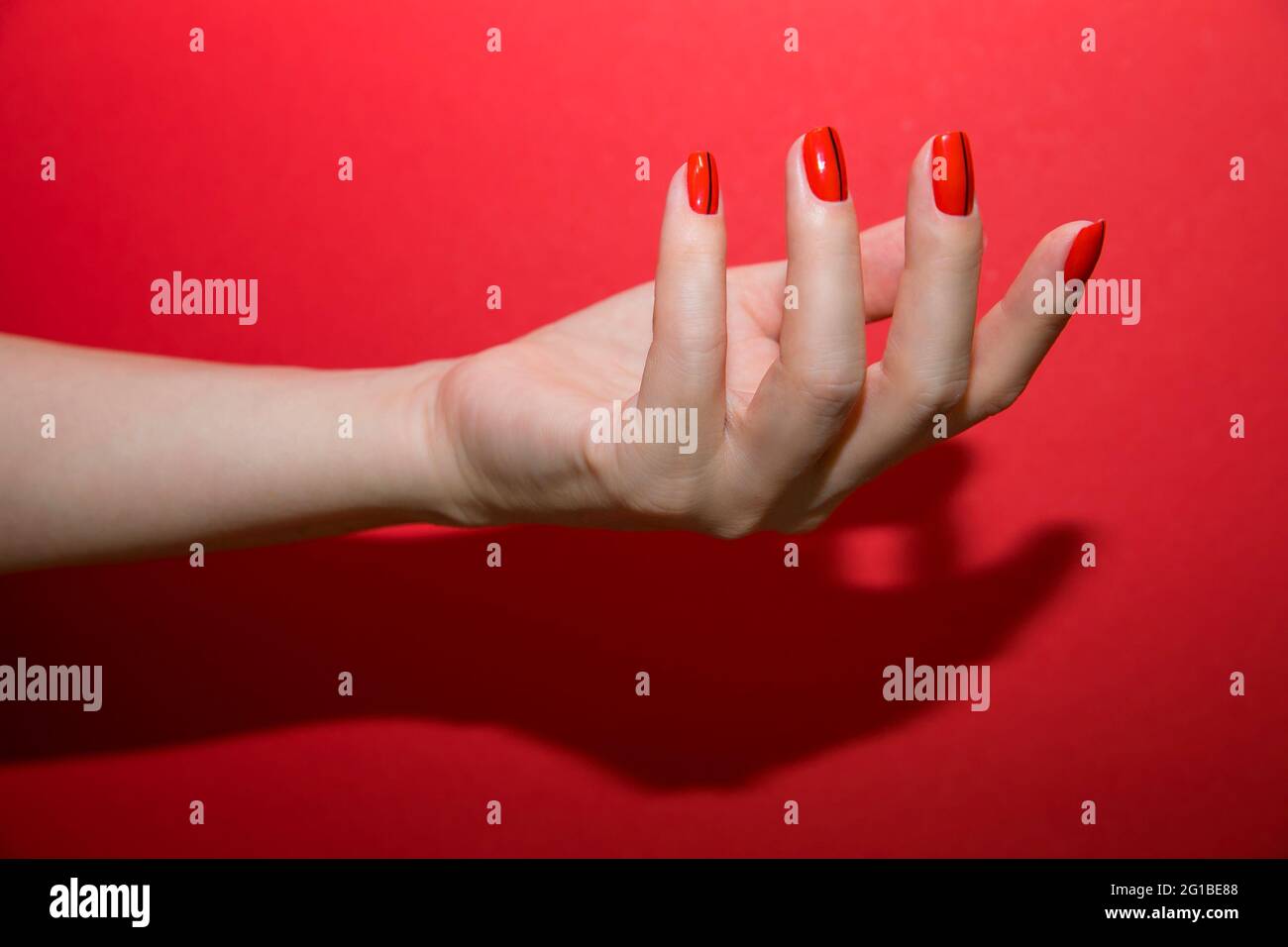 Beautiful female hands with red manicure and nail isolated. Manicured ...