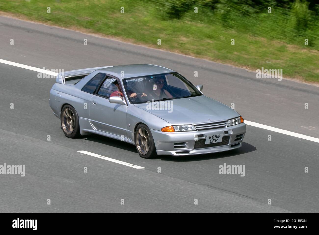 1993 90s Silver Nissan Skyline GT-R 2598cc driving on the M6 motorway ...