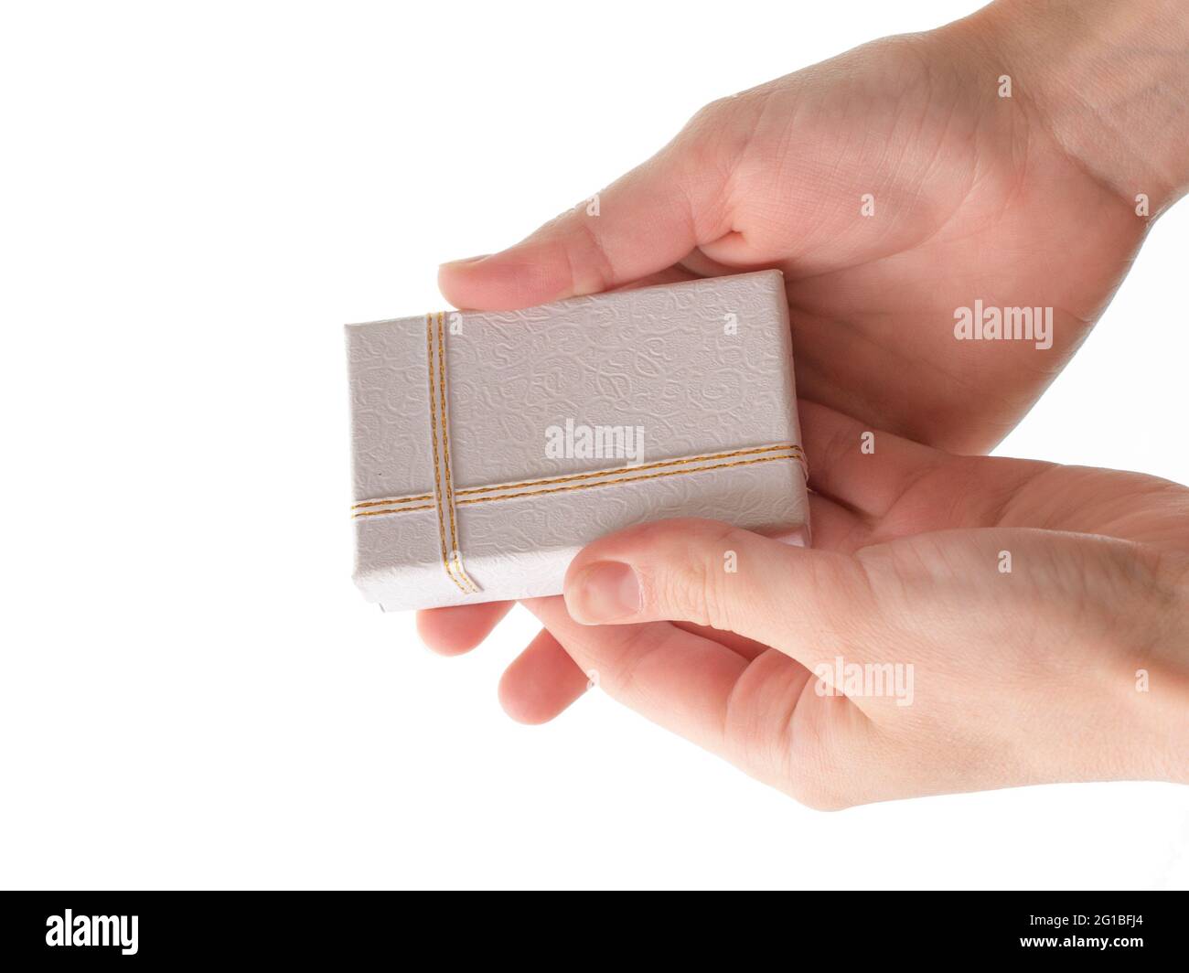 Female hands hold a small gift box on a white background Stock Photo ...