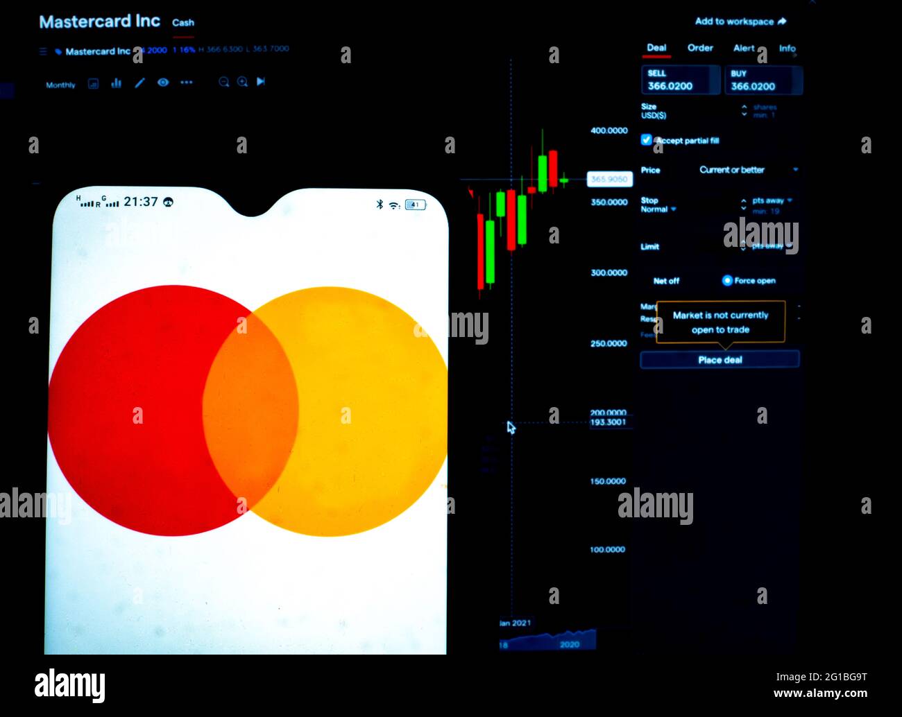 In this photo illustration a Mastercard logo seen displayed on a ...