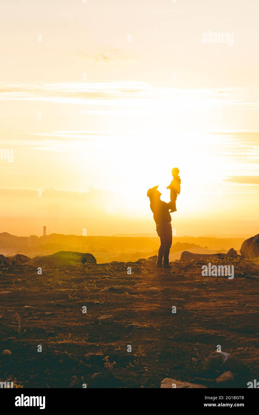 Man lifting child silhouette hi-res stock photography and images - Alamy