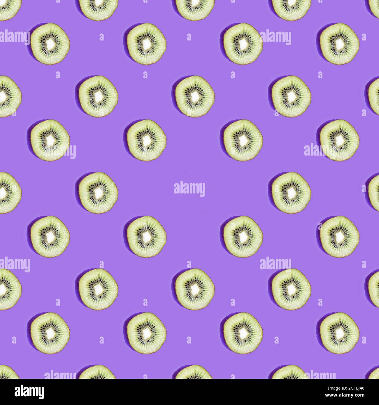 Kiwi repeating seamless pattern on purple background. Copy space Stock ...