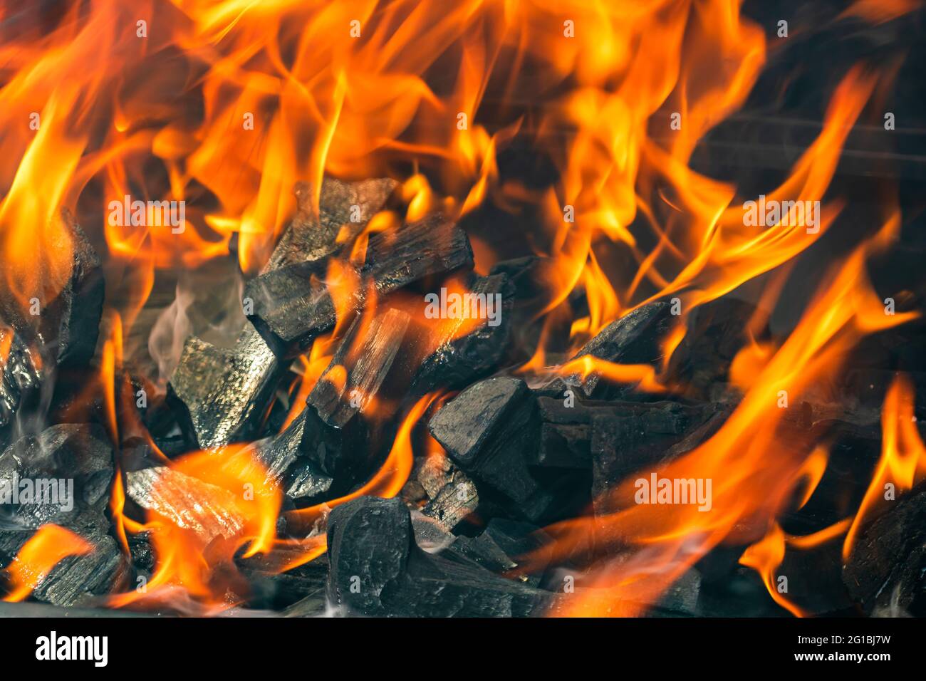 An amazing view of burning wood chips forming coal - Barbecue ...