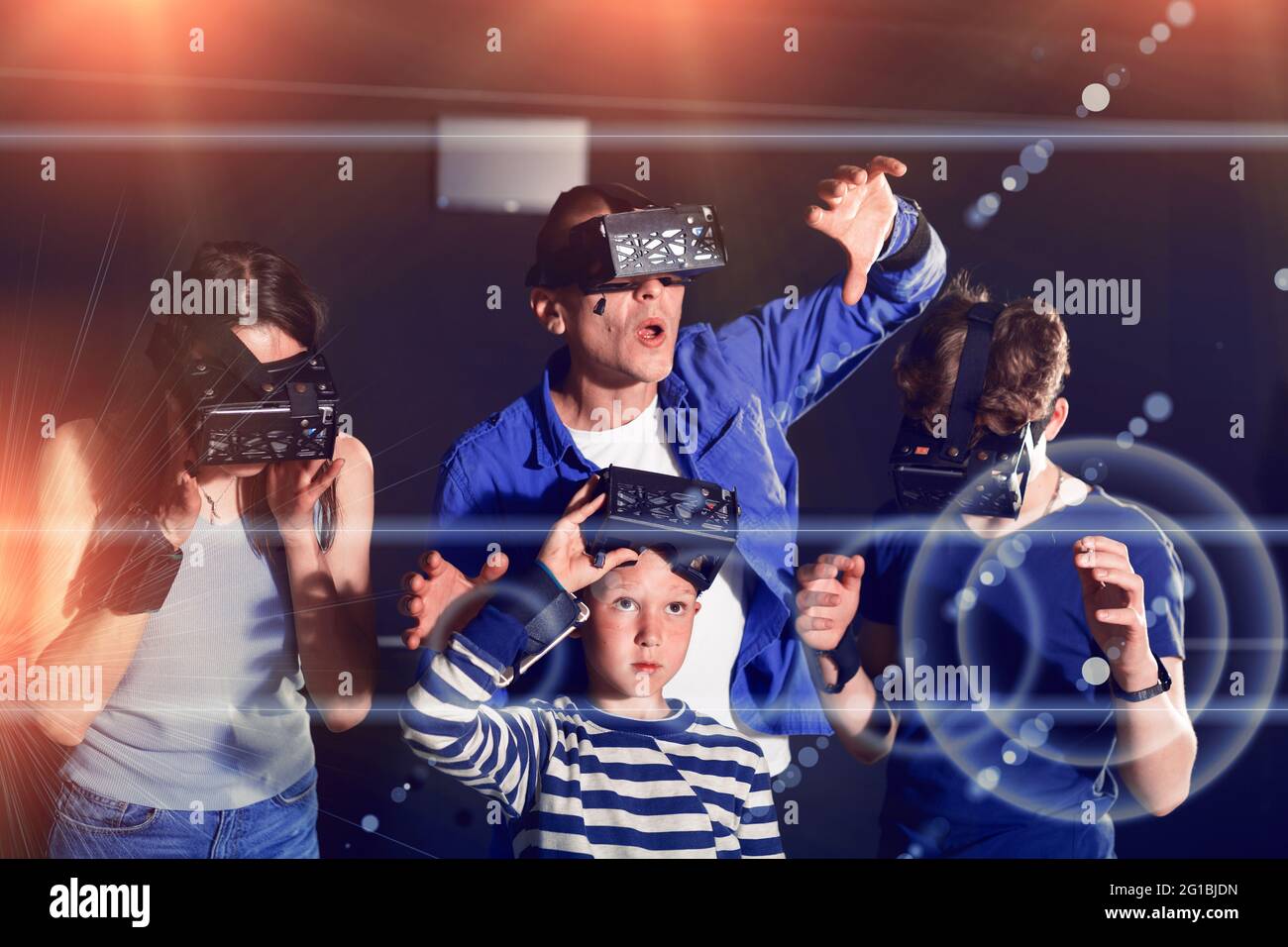 Emotional family having fun with vr headset goggles Stock Photo - Alamy