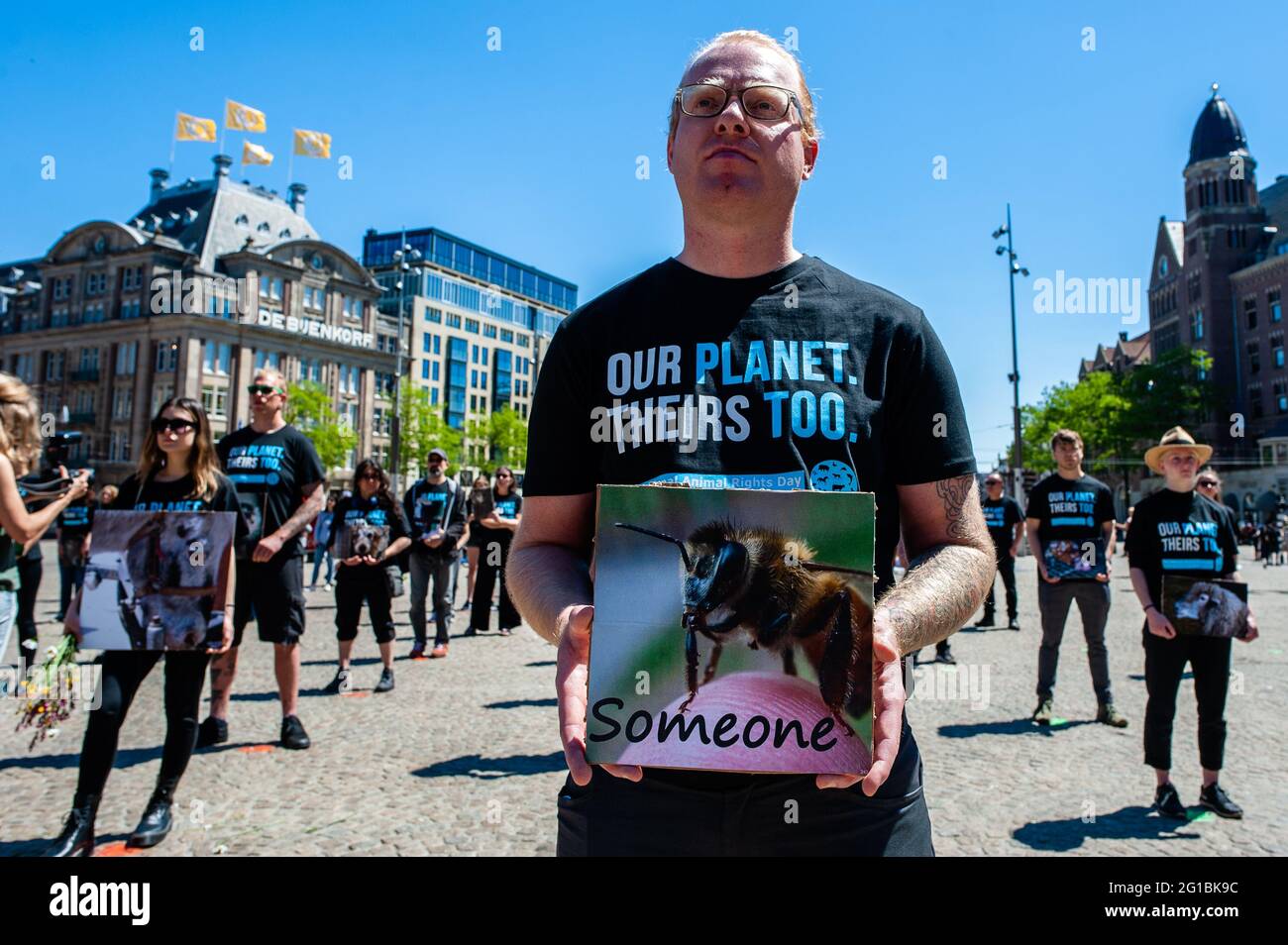 Animal activists wearing t-shirts with the slogan "Our Planet. Theirs ...