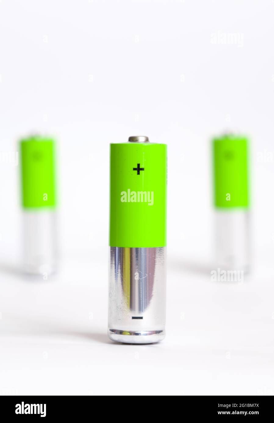 green AA Batteries Closeup on white Background Stock Photo - Alamy