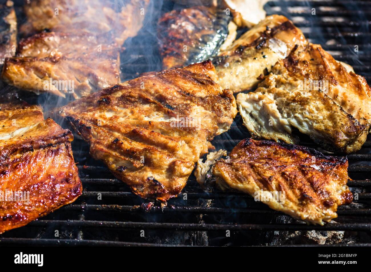 Delicious grilled mackerel fish being cooked on a charcoal grill Stock ...