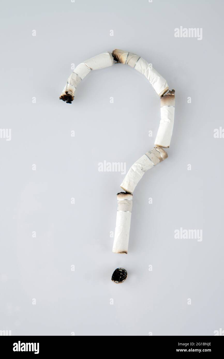 Question mark with burnt cigarettes background Stock Photo - Alamy