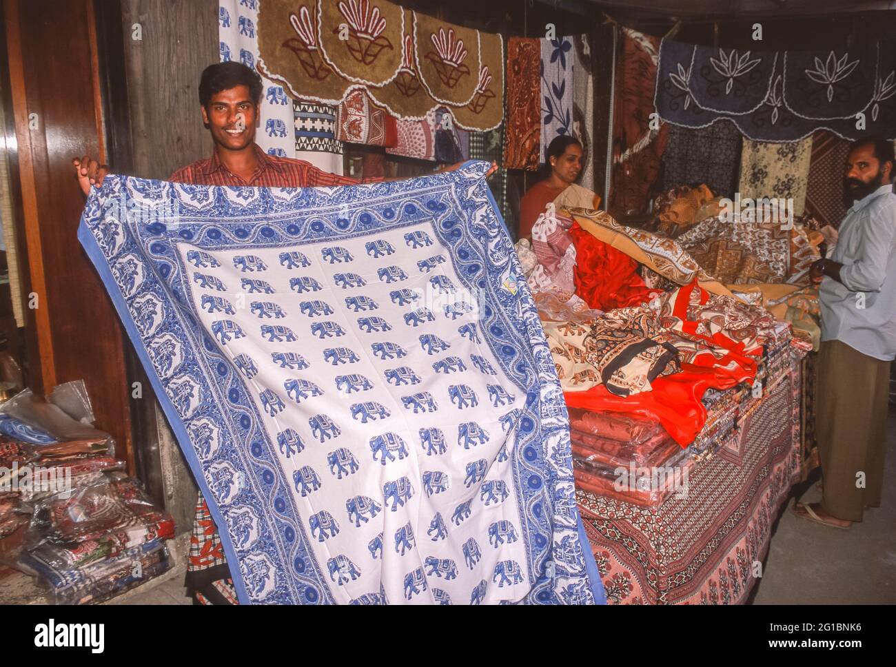COCHIN, KERALA, INDIA - Fabric vendor in shop Stock Photo - Alamy