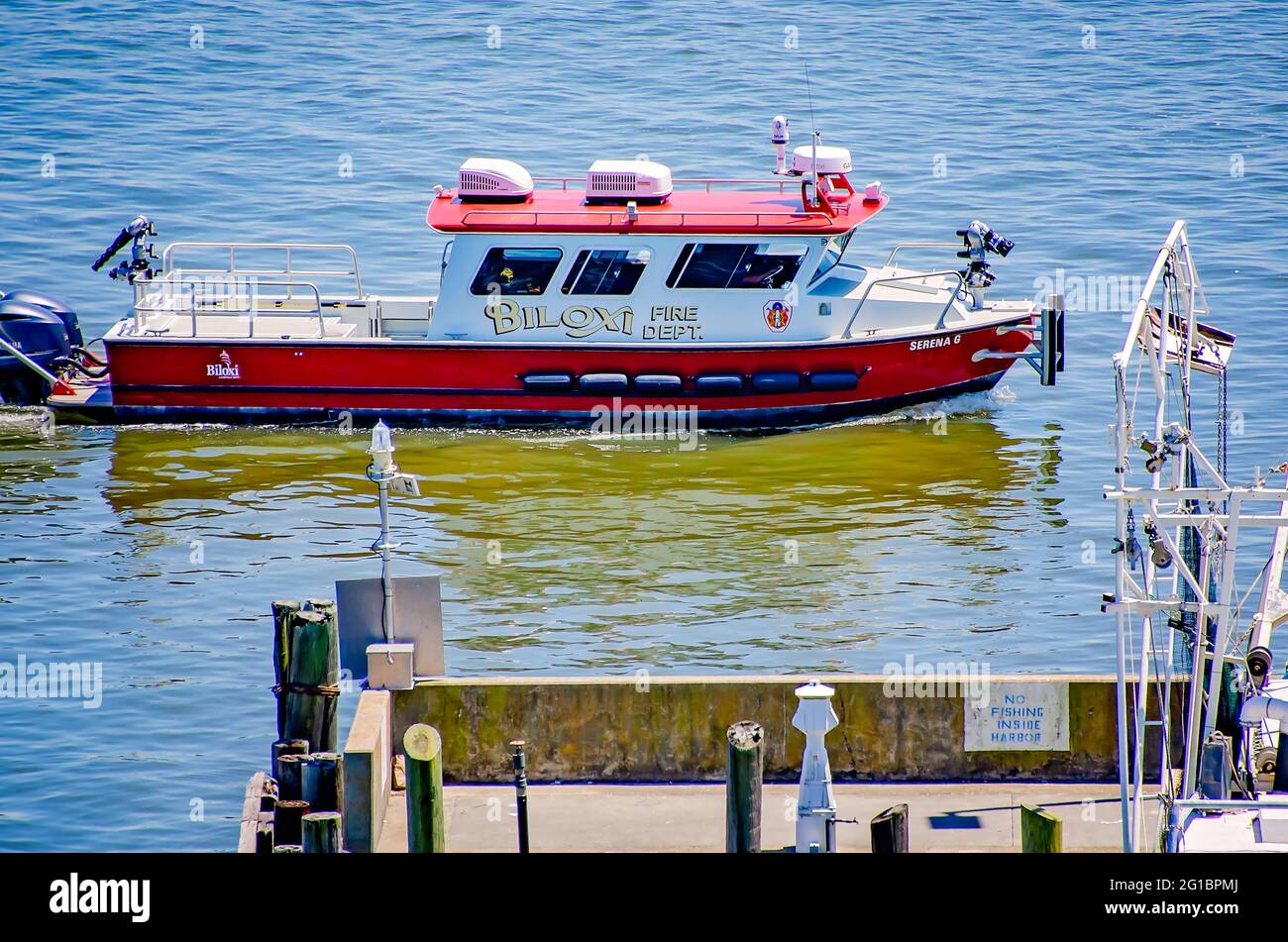 The Biloxi Fire Department’s fireboat, Serena G, passes Biloxi Small ...