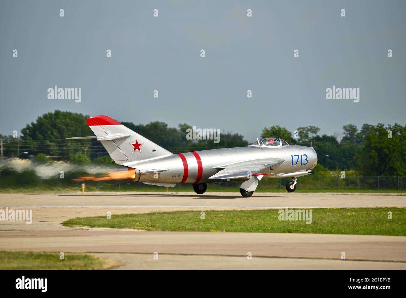 Russian MiG-17 high-subsonic fighter aircraft, with jet engine flaring ...