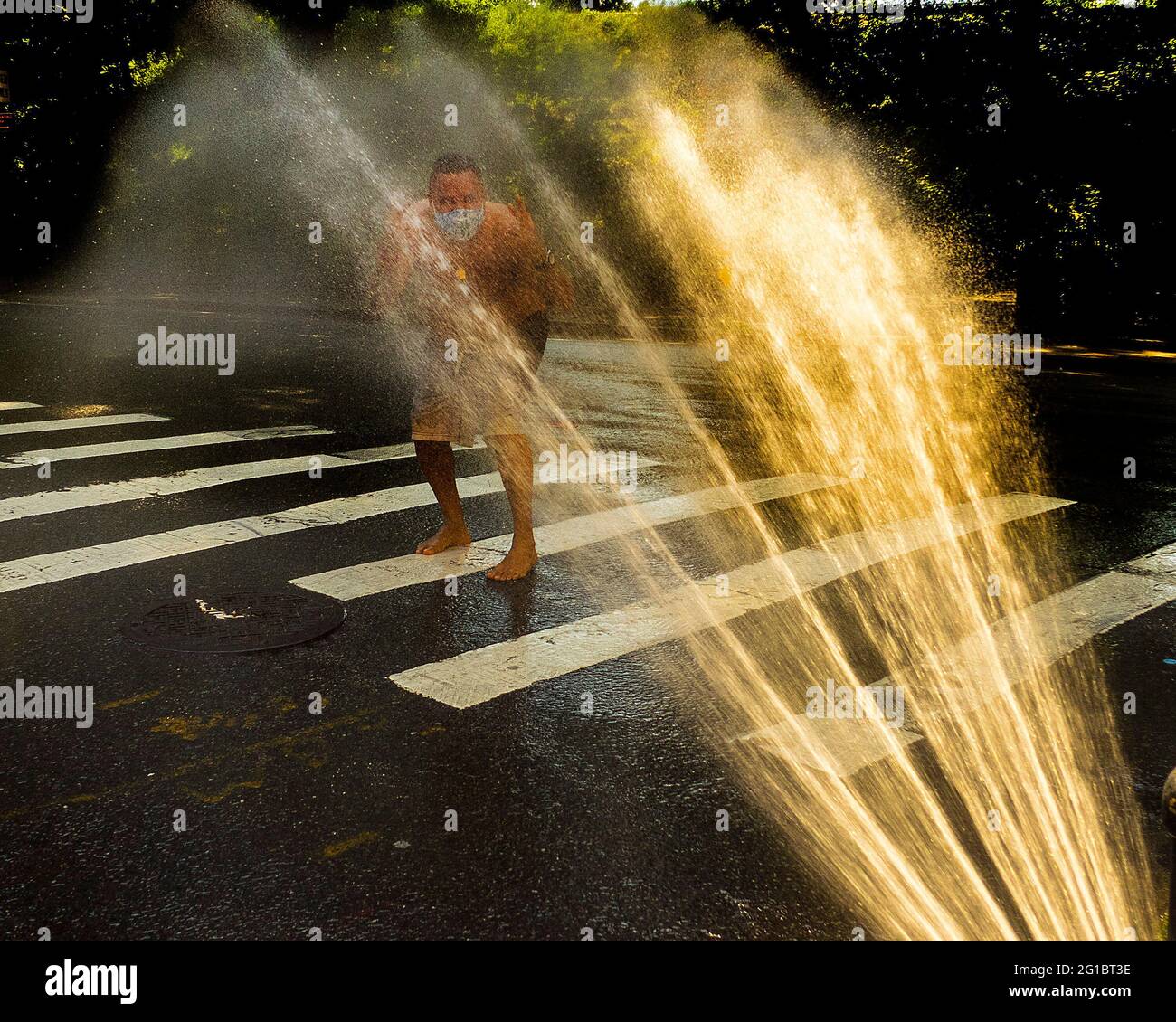 New York, New York, USA. 6th June, 2021. A man cools off in the ...