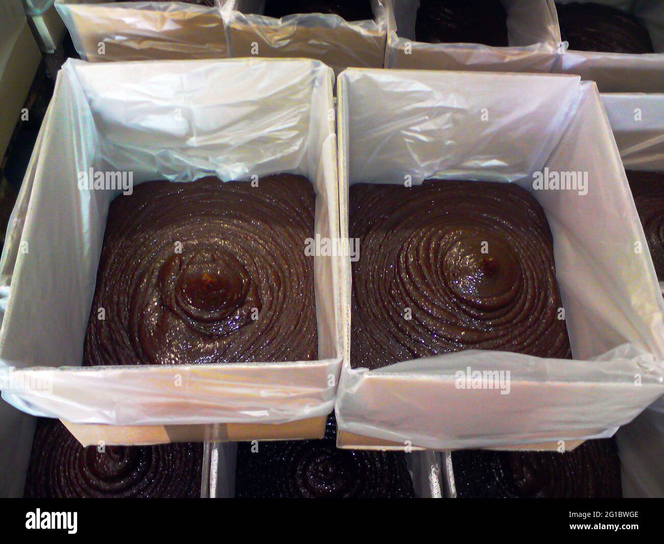 Top view of fruit jam made in the factory. Jam in boxes in production ...