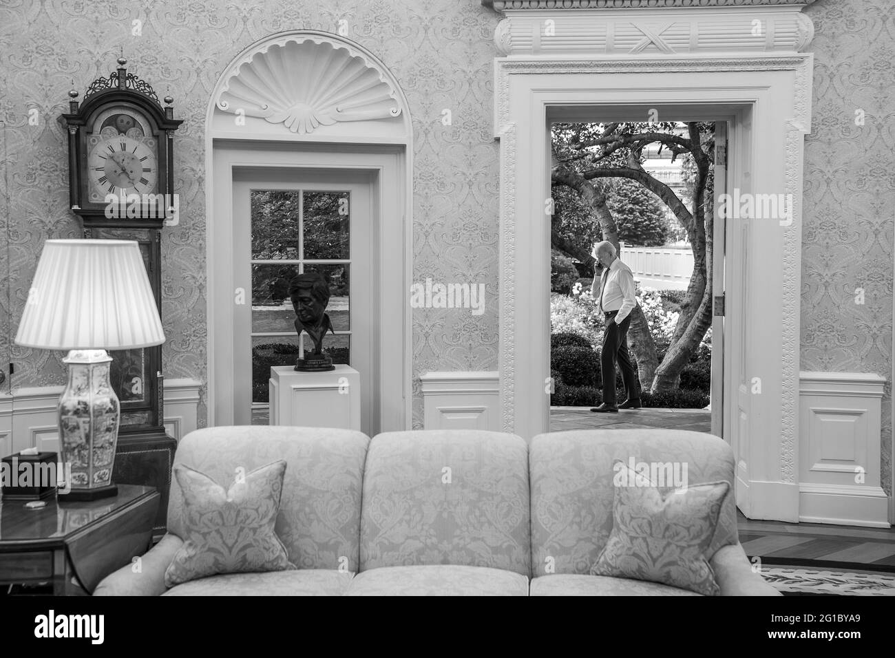 President Joe Biden makes a call on Wednesday, May 26, 2021, outside ...