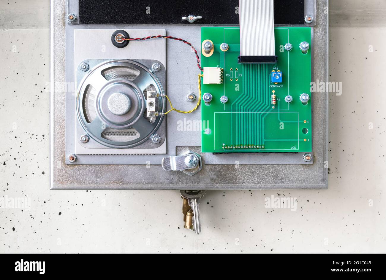 Open intercom cabinet with ribbon cable, lcd interface and speaker ...