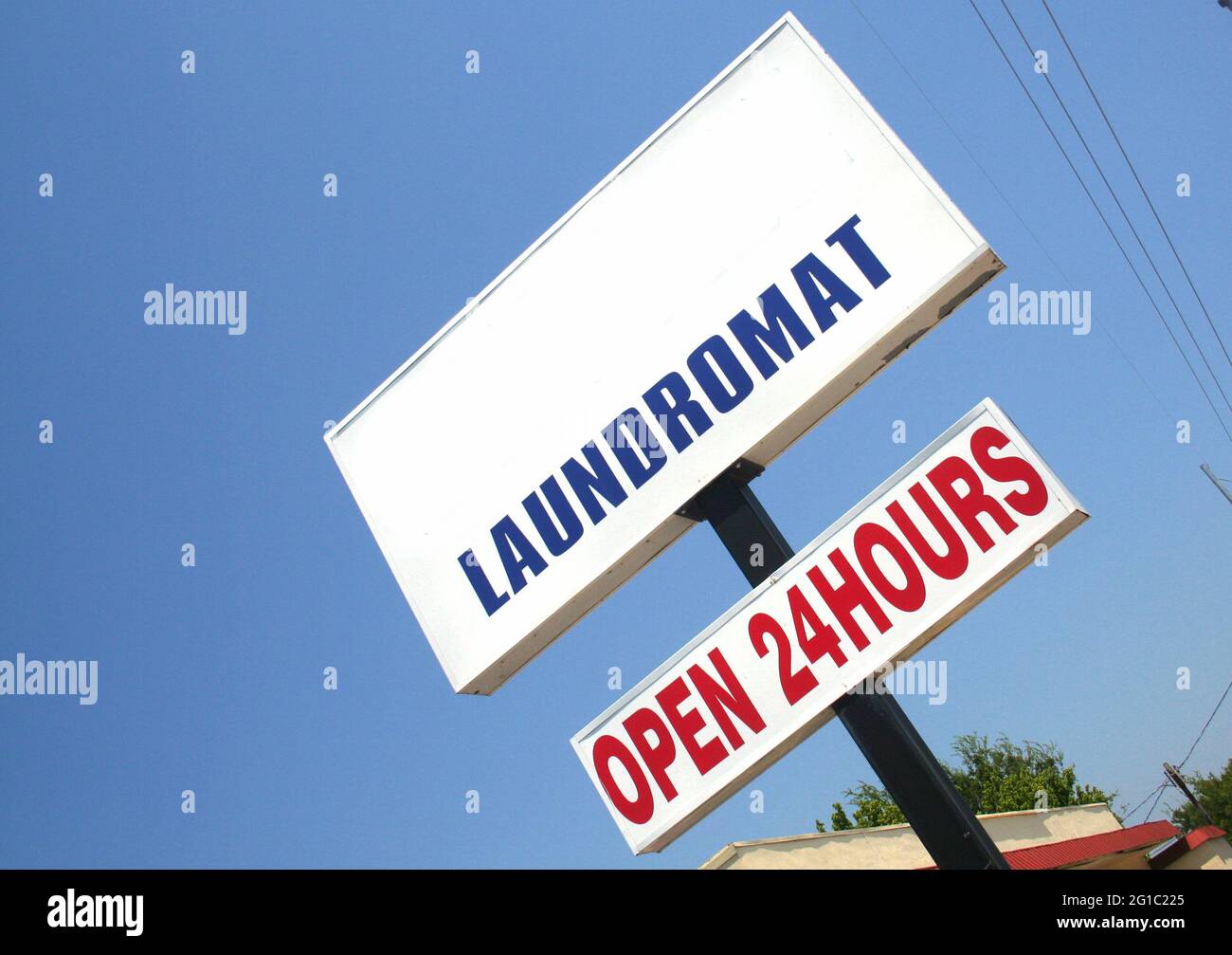 Laundromat Sign With Blue Sky Background Stock Photo - Alamy