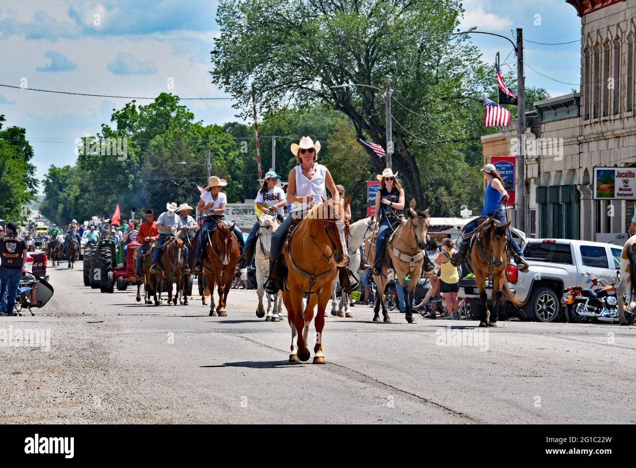 Cowboys and Cowgirls ride in the annual Flint Hills Rodeo parade in ...