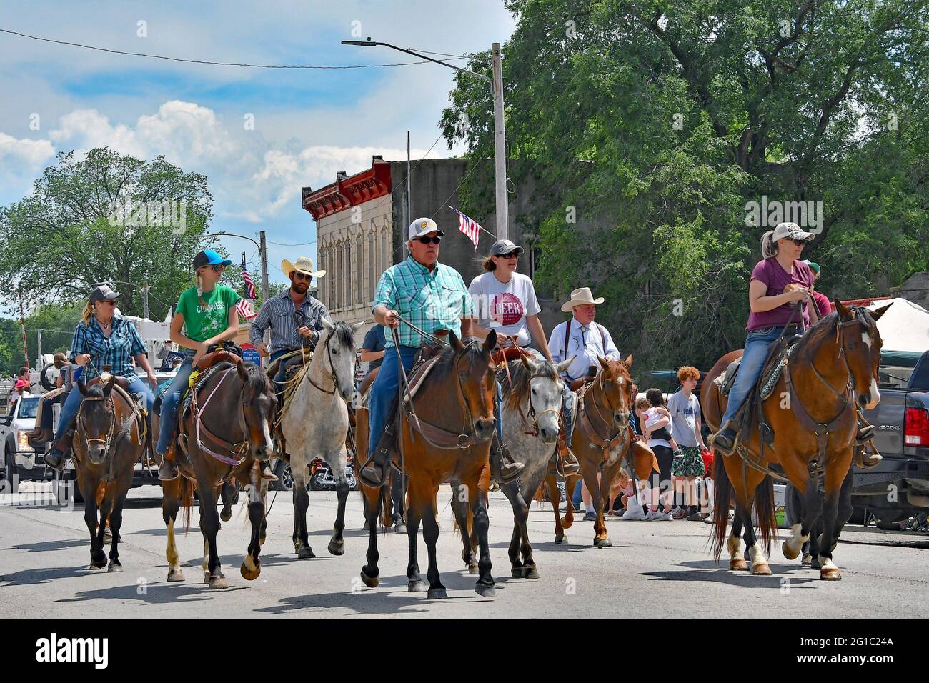 Cowboys and Cowgirls ride in the annual Flint Hills Rodeo parade in ...
