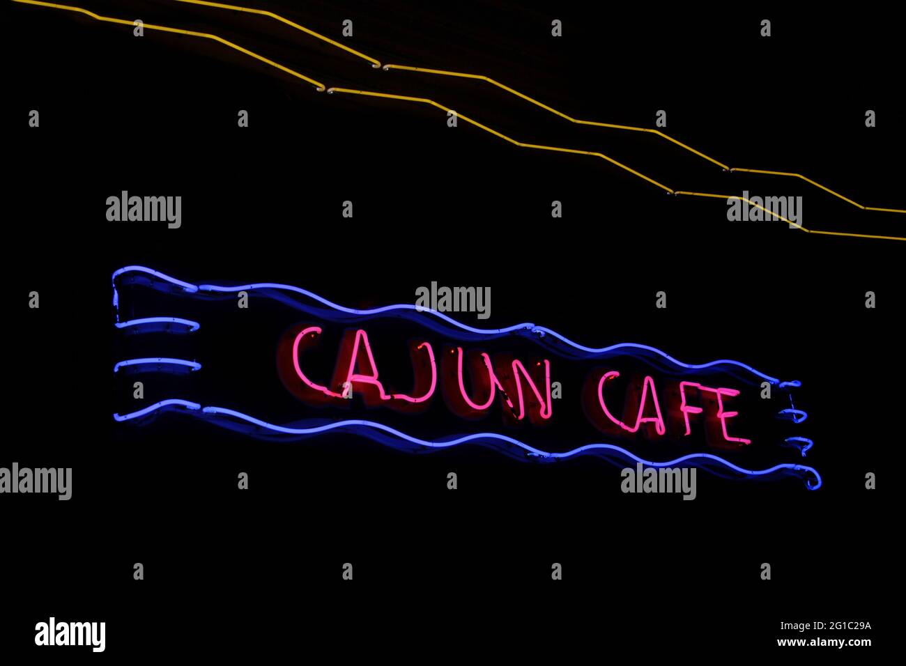 Vintage Neon Cajun Cafe Sign on Restaurant Wall Stock Photo - Alamy