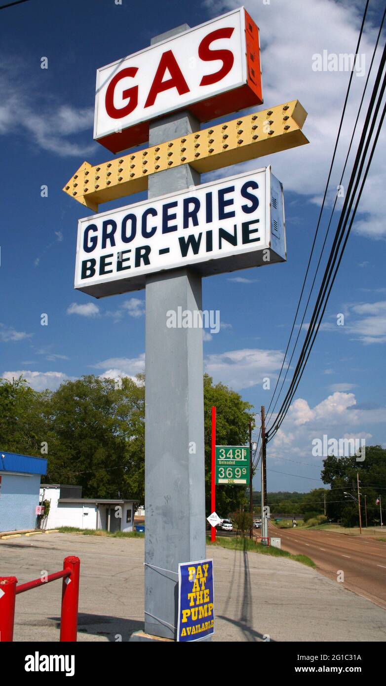 Gas, Beer and Grocery Sign with Blue Sky and Clouds Stock Photo - Alamy