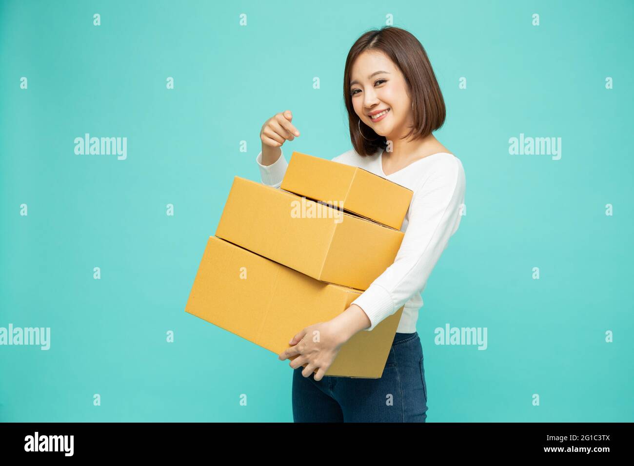 Happy Asian woman holding package parcel box, Delivery courier and ...