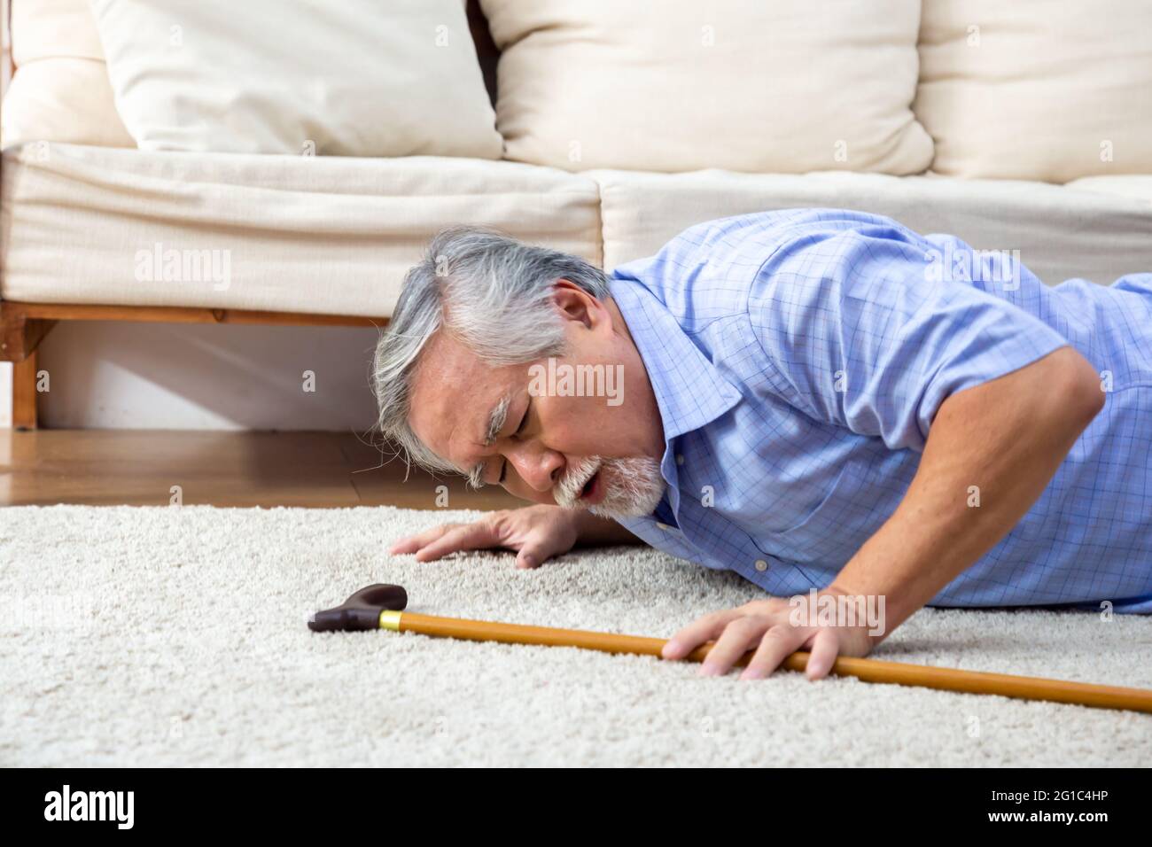 Old man lying floor hi-res stock photography and images - Alamy