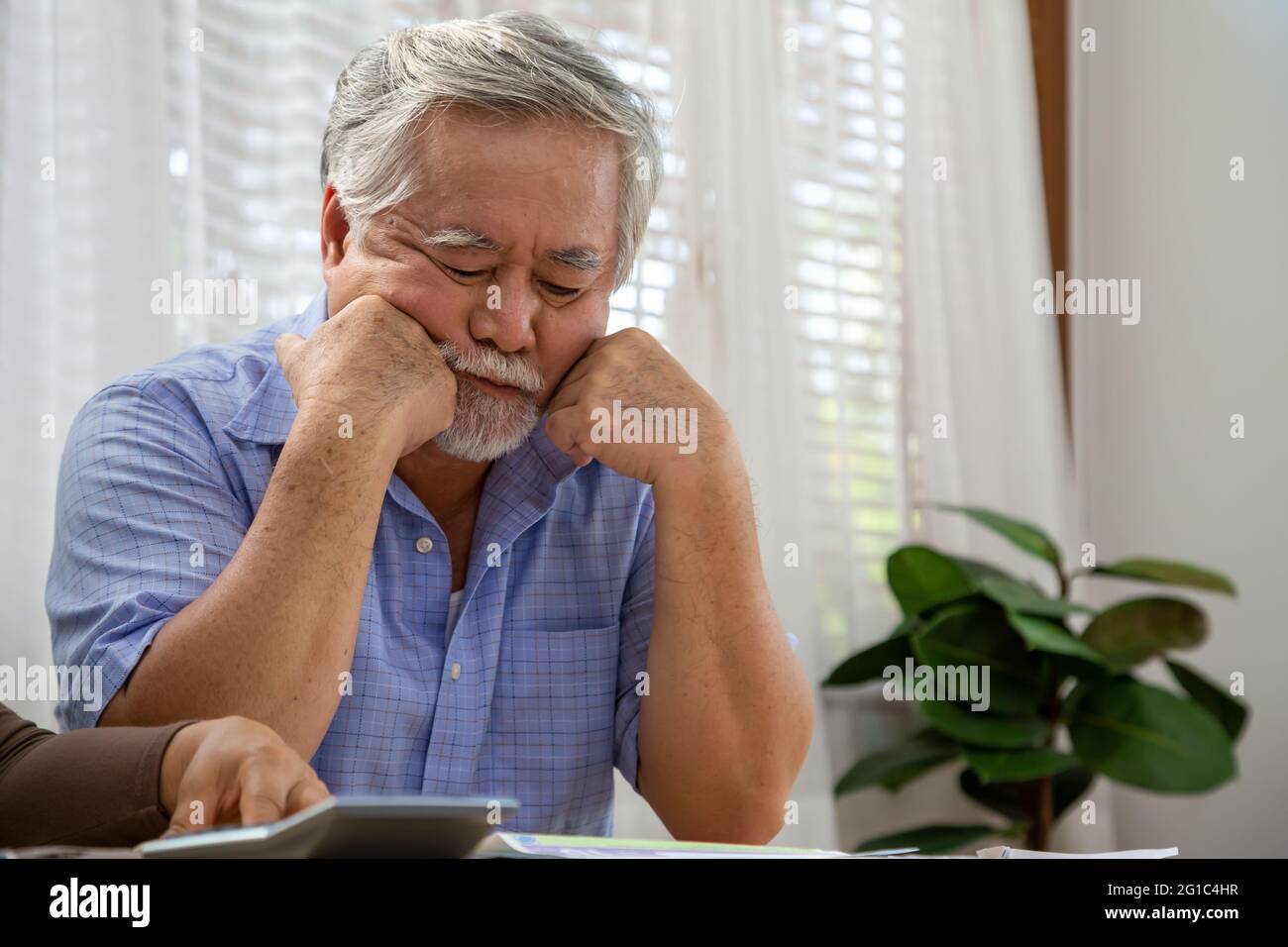 Depressed man asian elderly hi-res stock photography and images - Alamy
