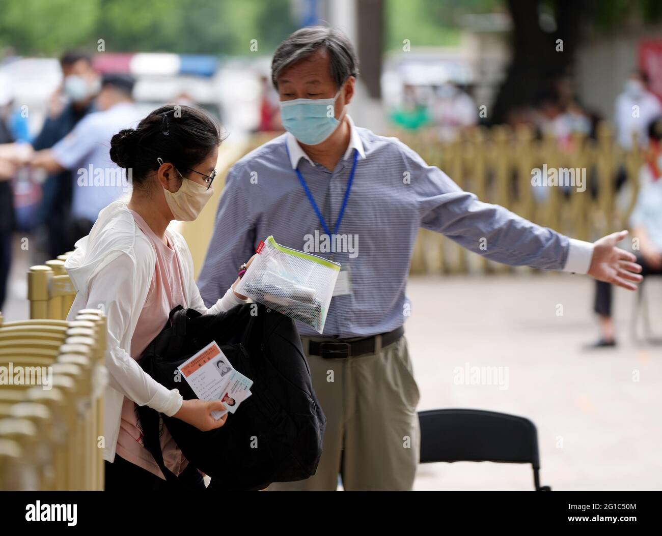 Beijing, China. 7th June, 2021. An examinee enters an exam site at a ...