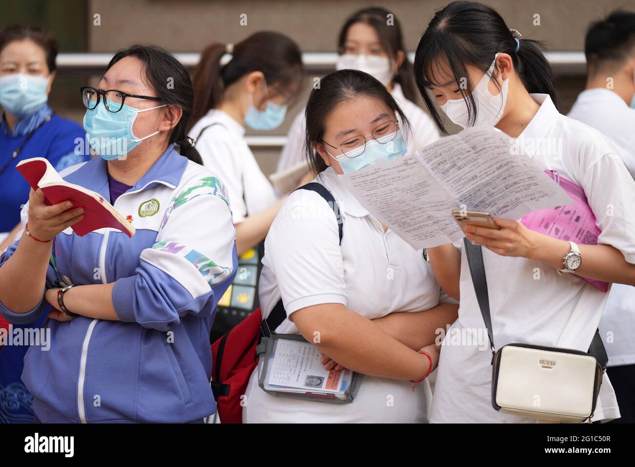Beijing, China. 7th June, 2021. Examinees flip through learning ...