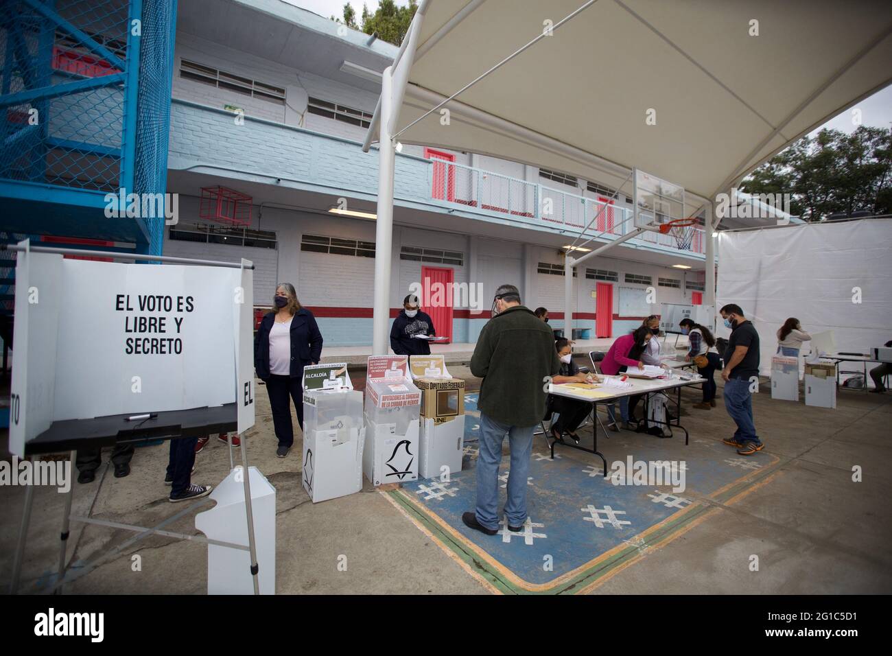 MEXICO CITY, MEXICO - JUNE 6, 2021: A citizen attends at a polling ...