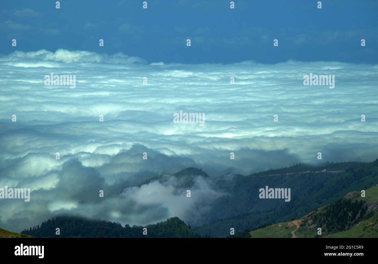 Panoramic photo of the clouds descending to the earth and spreading ...