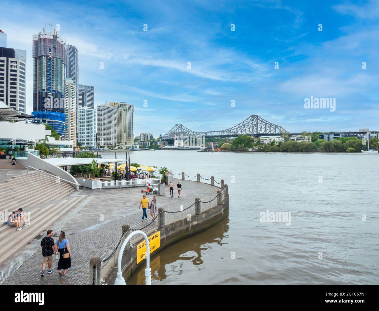 People walking the path for pedestrians and cyclist next to the ...