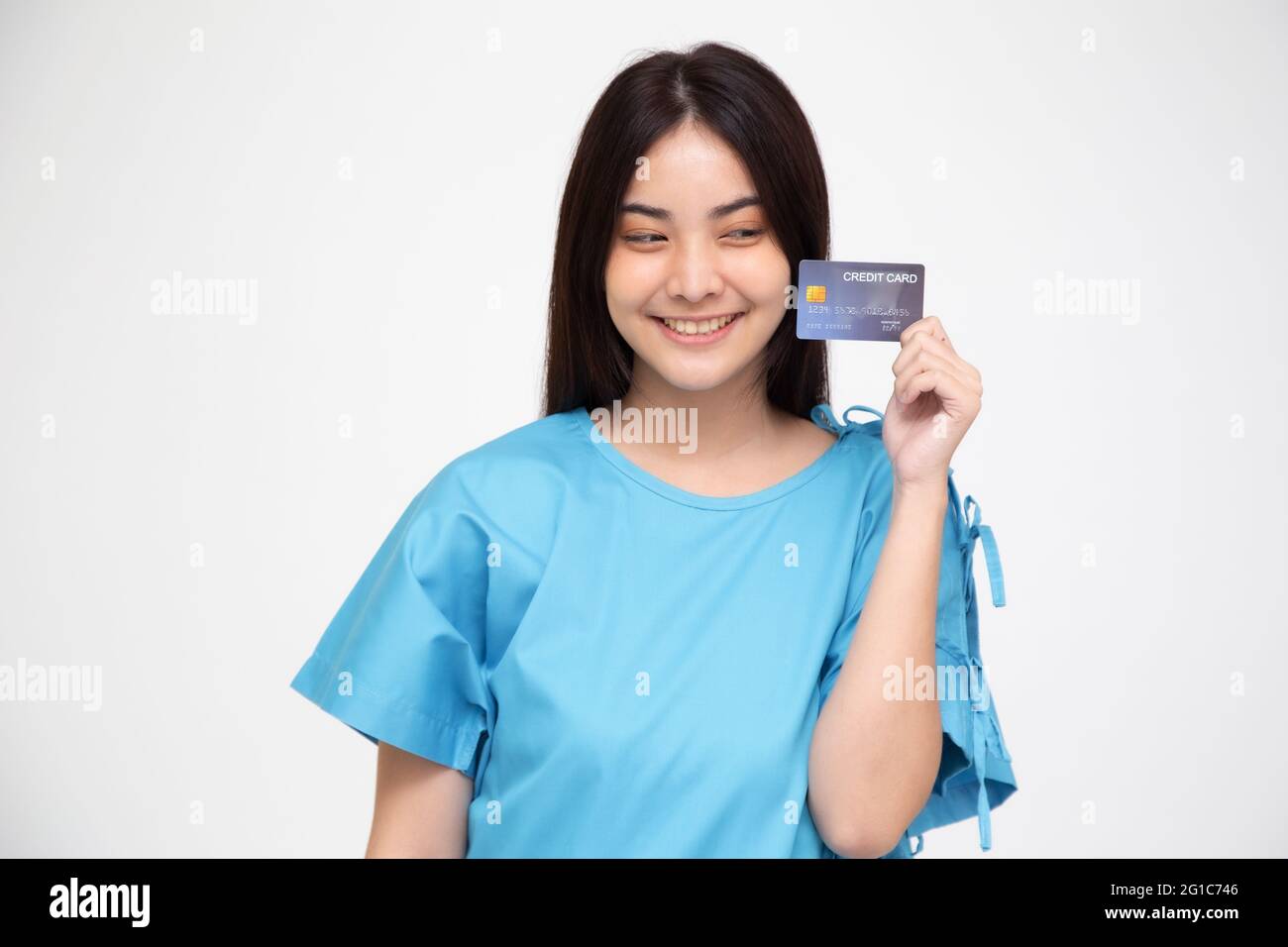 Young Asian beautiful woman patient showing credit card isolated on ...