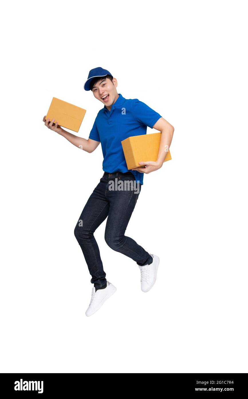Young Asian delivery man jumping and holding parcel box isolated on ...