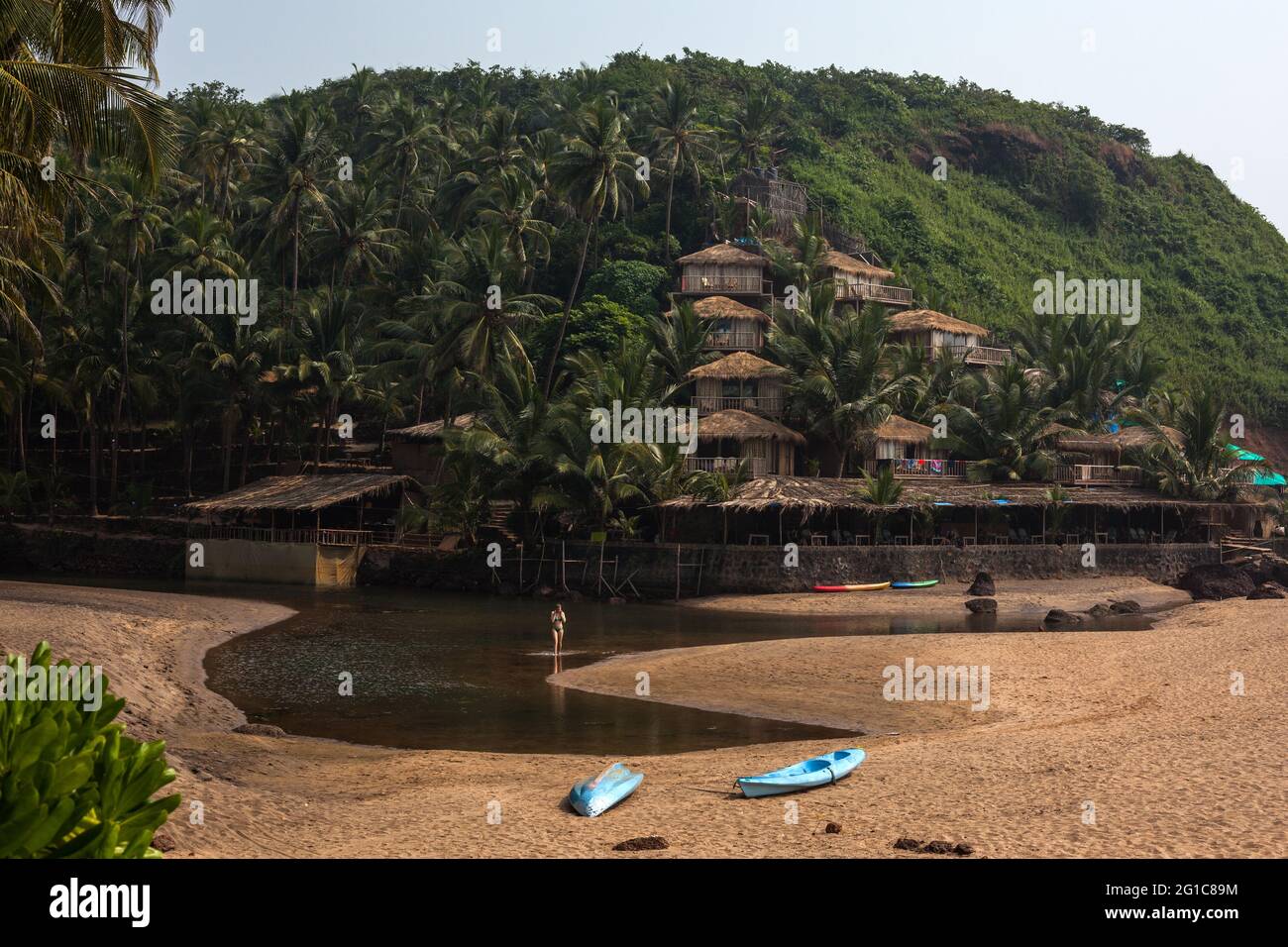 Female wading in the lagoon at Cola (Khola) Beach (also known as Secret ...
