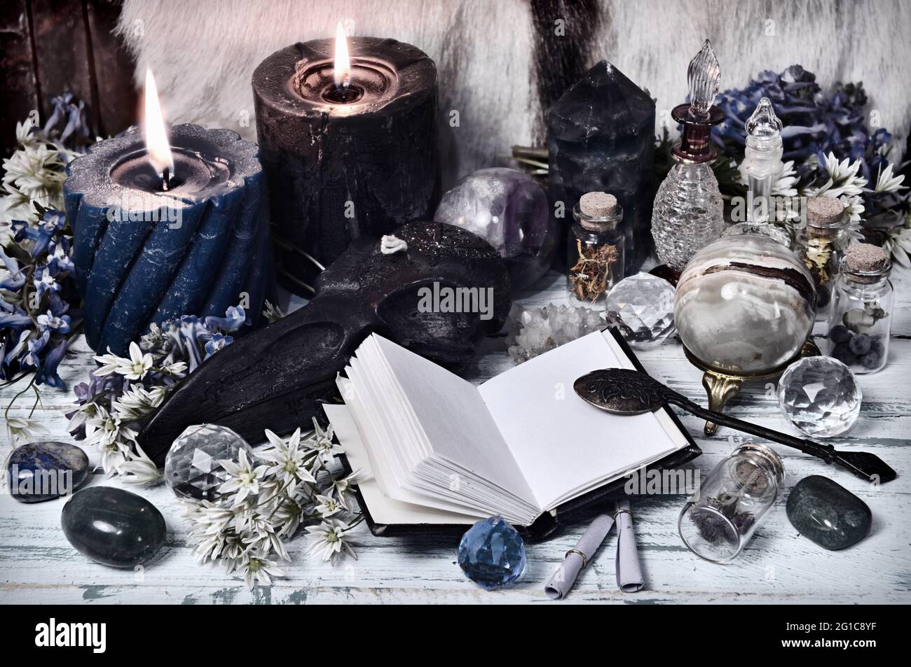 Grunge still life with open diary book, crystals, flowers and burning ...