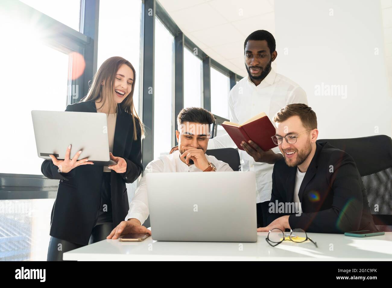 Many cheerful white collar workers at meeting in the office Stock Photo ...